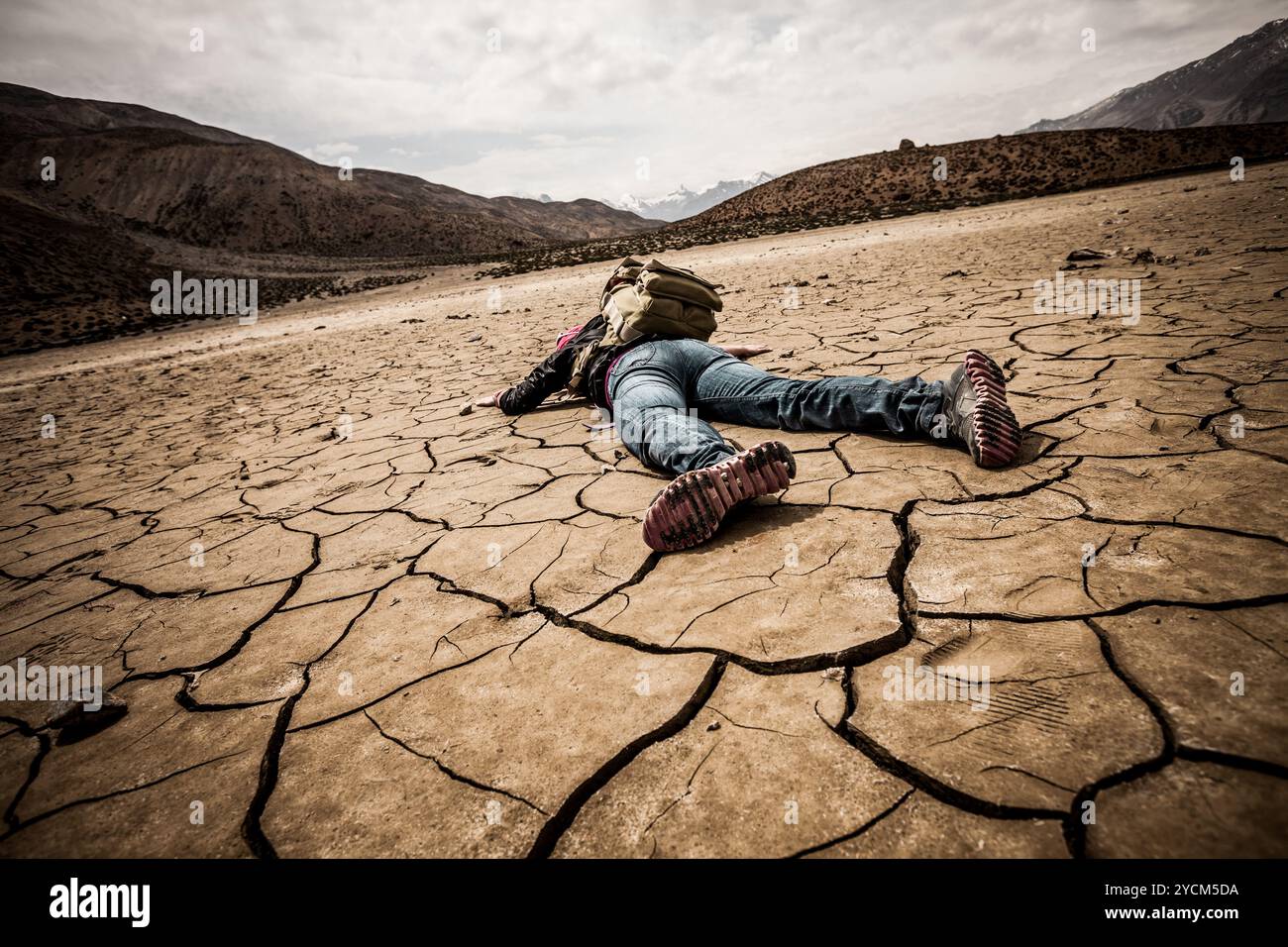 Person lays on the dried ground Stock Photo - Alamy