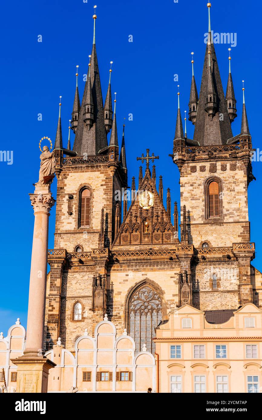 Statue of Virgin 'Mary of the Square' and the spires of the church of ...