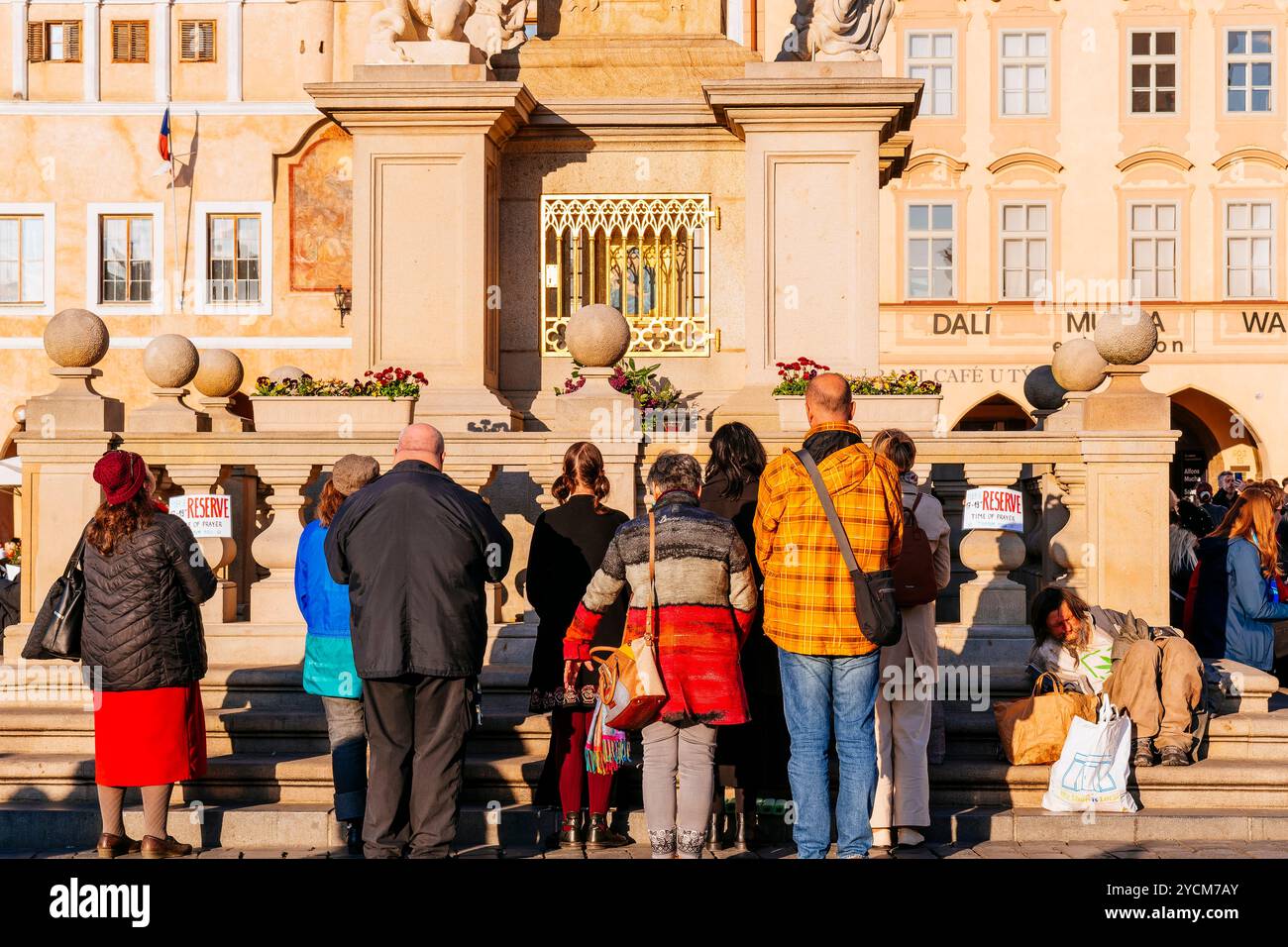 People praying in front of the sacred space with the image of the ...
