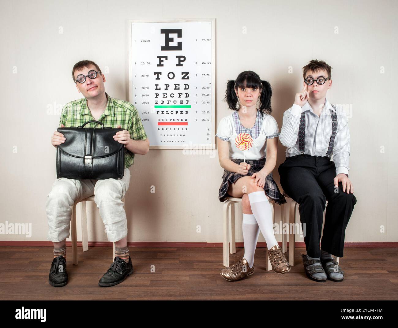 Three person wearing spectacles in an office at the doctor Stock Photo ...