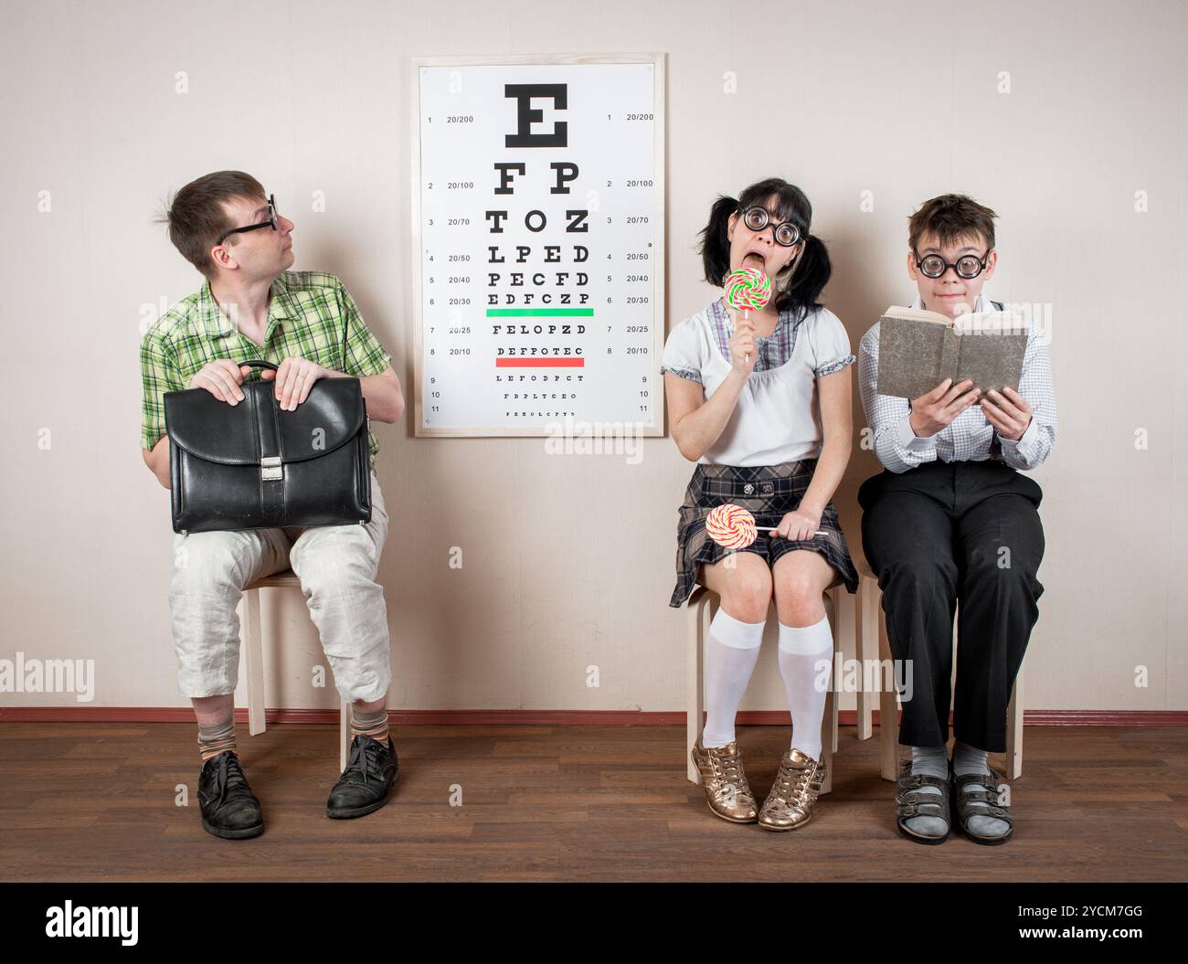 Three person wearing spectacles in an office at the doctor Stock Photo ...