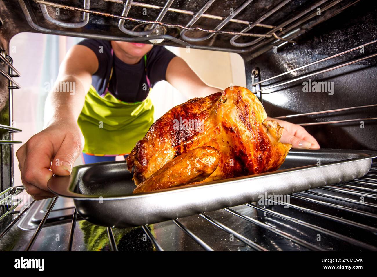 Woman chicken kitchen hi-res stock photography and images - Alamy