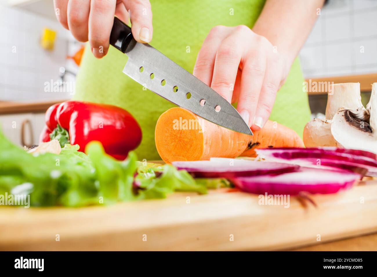 Woman's hands cutting vegetables Stock Photo - Alamy