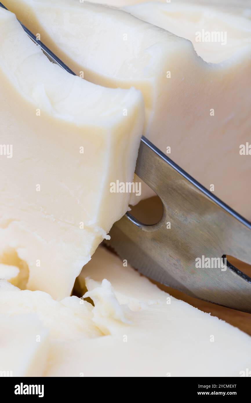 Sliced white sheese maasdam hi-res stock photography and images - Alamy