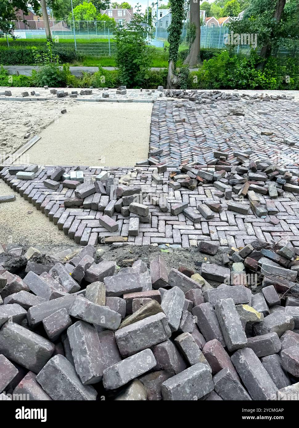 Process of laying paving stone blocks outdoors Stock Photo - Alamy