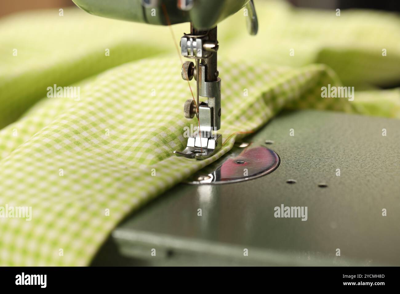 One sewing machine with thread and fabric, macro view Stock Photo - Alamy