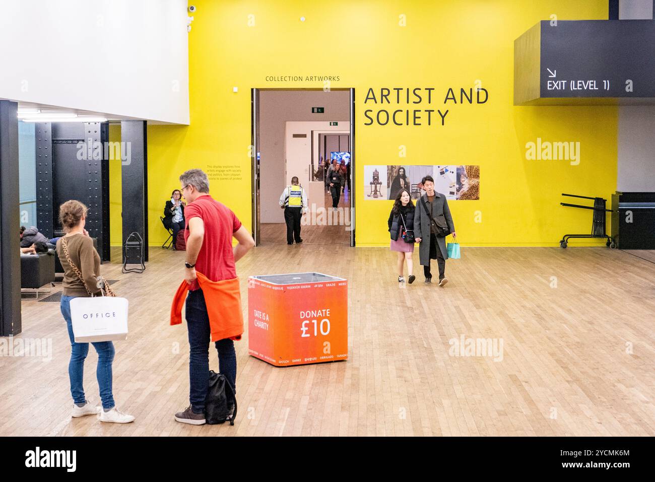 People gather outside the Artists and Society Collection Artworks room ...