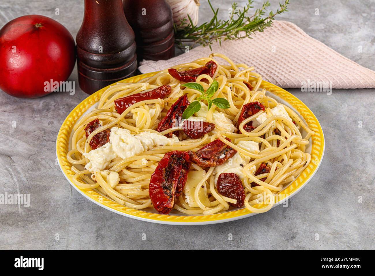Italian pasta spaghetti with stracciatella and tomato Stock Photo - Alamy