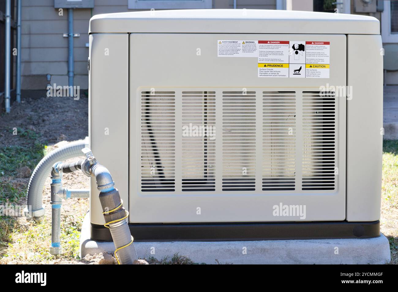 Standby home generator set in residential backyard, emergency backup ...