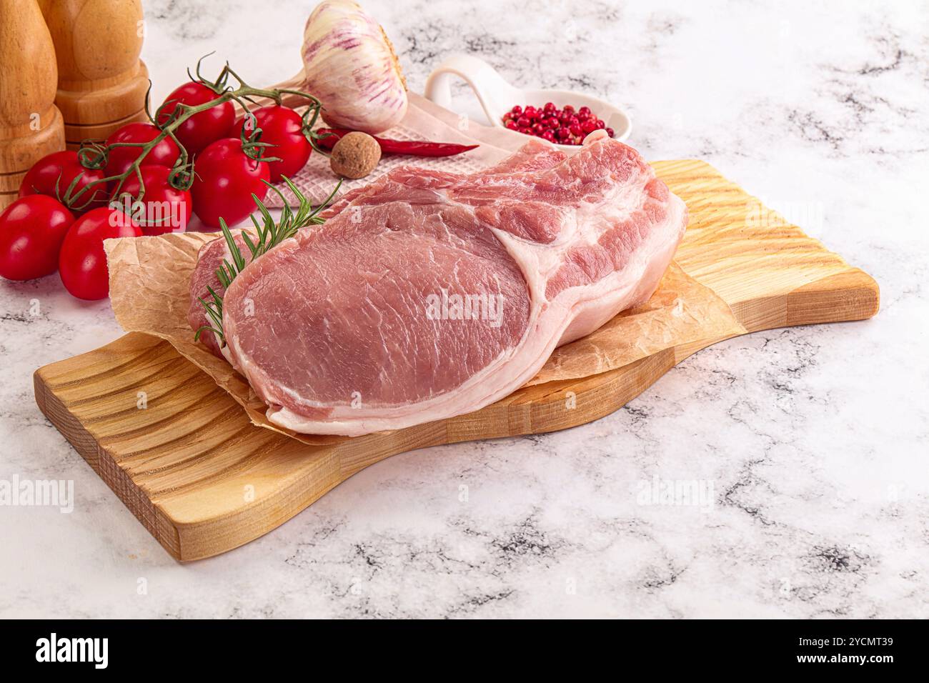 Raw potk loin steak with bone for cooking Stock Photo - Alamy