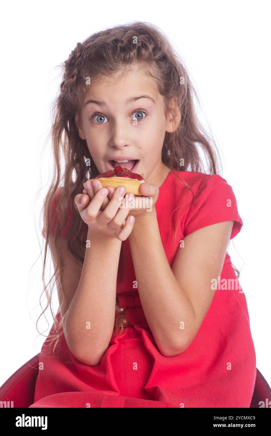 Girl enjoy cake, isolated Stock Photo - Alamy
