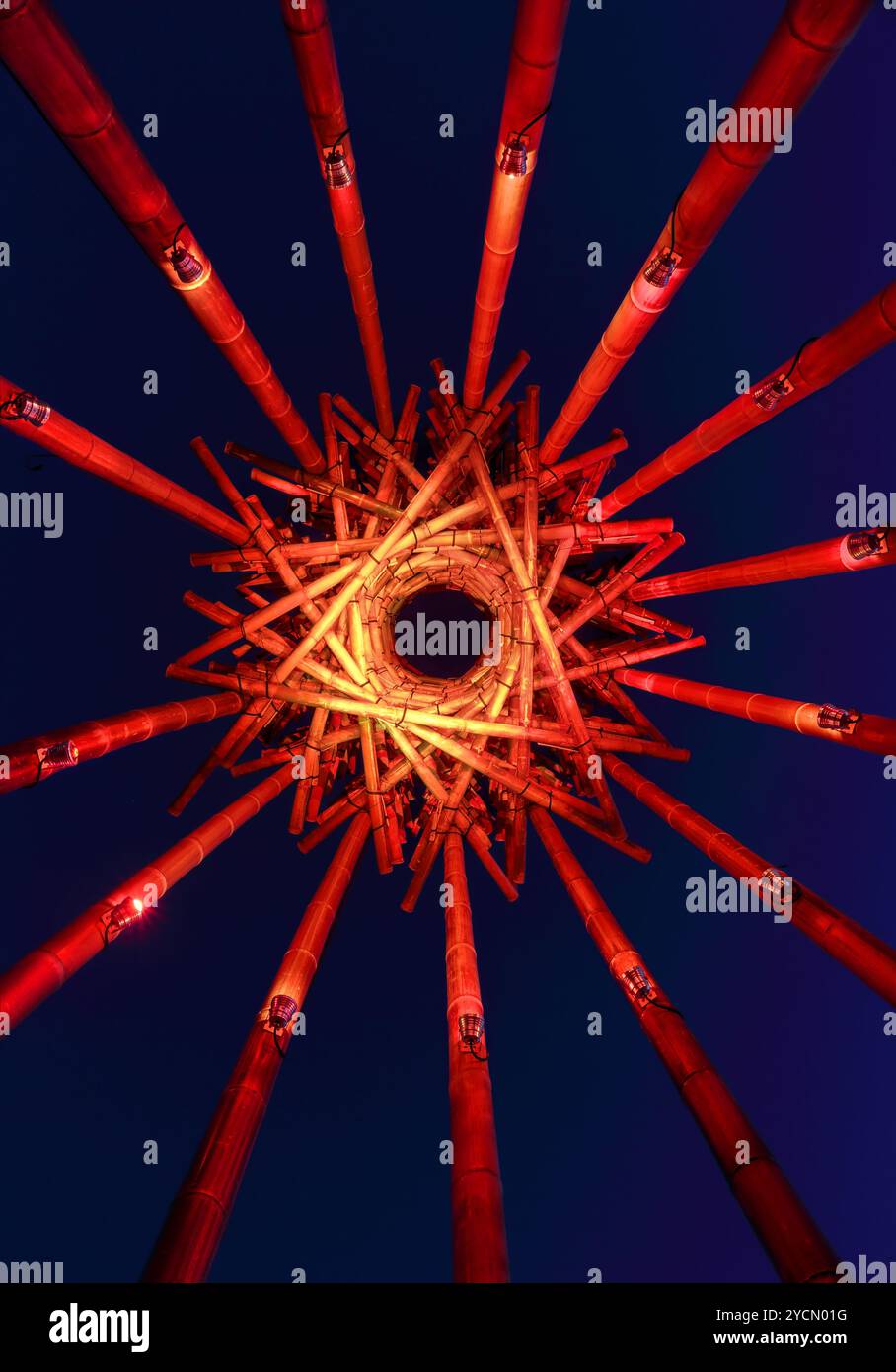 Abstract view of Save Our Souls sculpture lit up red Stock Photo - Alamy