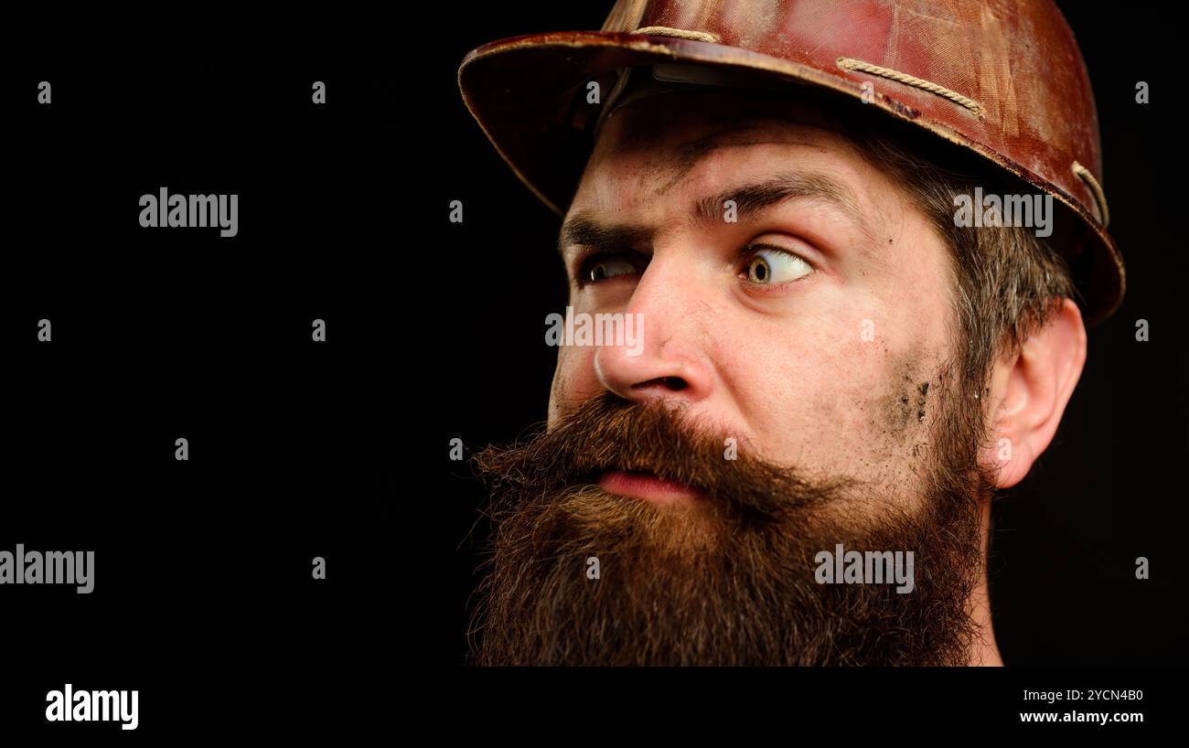 Closeup portrait serious builder man with dirty face in hard hat ...