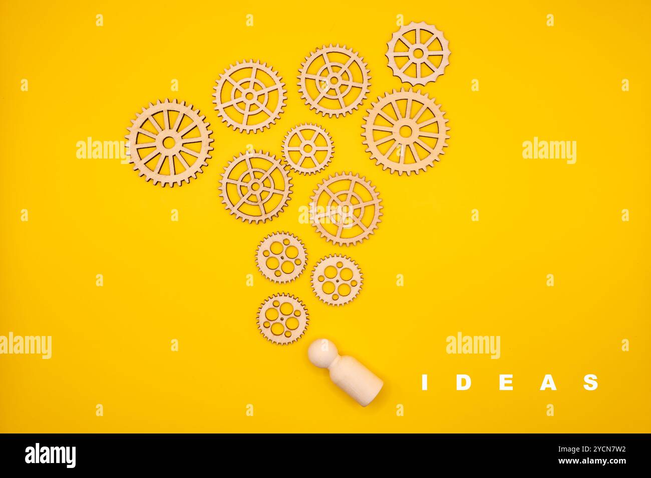 This intriguing series of images utilizes wooden gears and the word ...