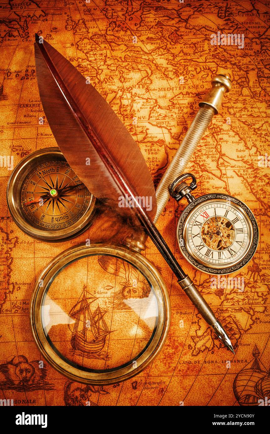 Vintage still life. Vintage items on ancient map Stock Photo - Alamy