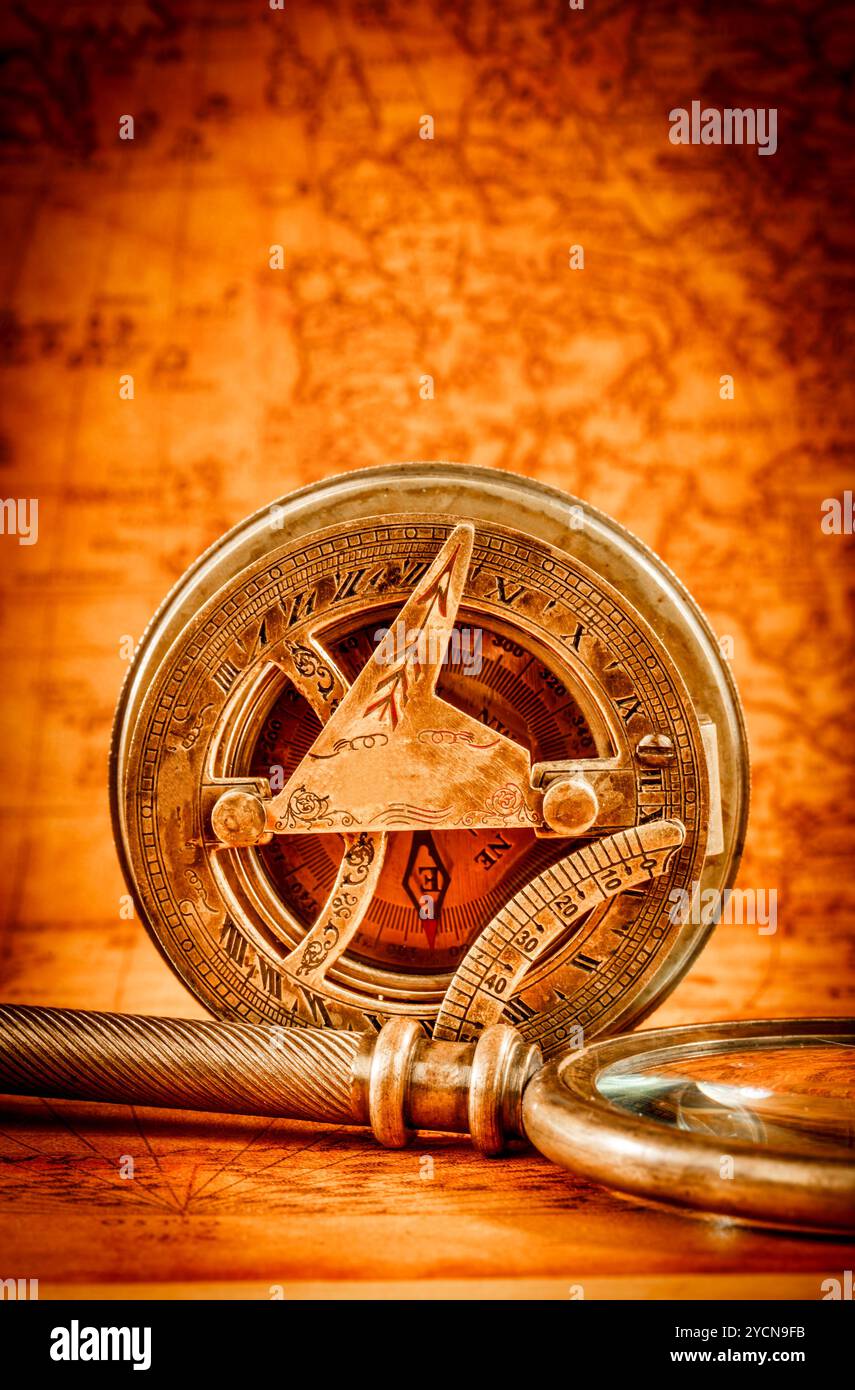 Vintage compass lies on an ancient world map Stock Photo - Alamy