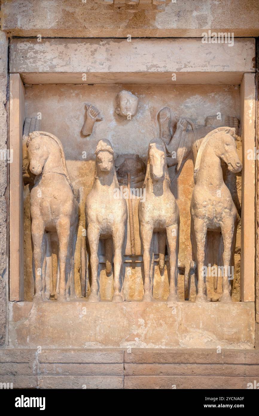 Metopa showing Apollo on a quadriga, side by side with Leto and Artemis ...