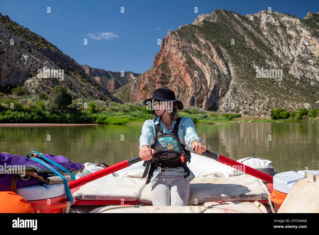 Dinosaur, Colorado - River guide Abbey Woodruff rows her raft on the ...