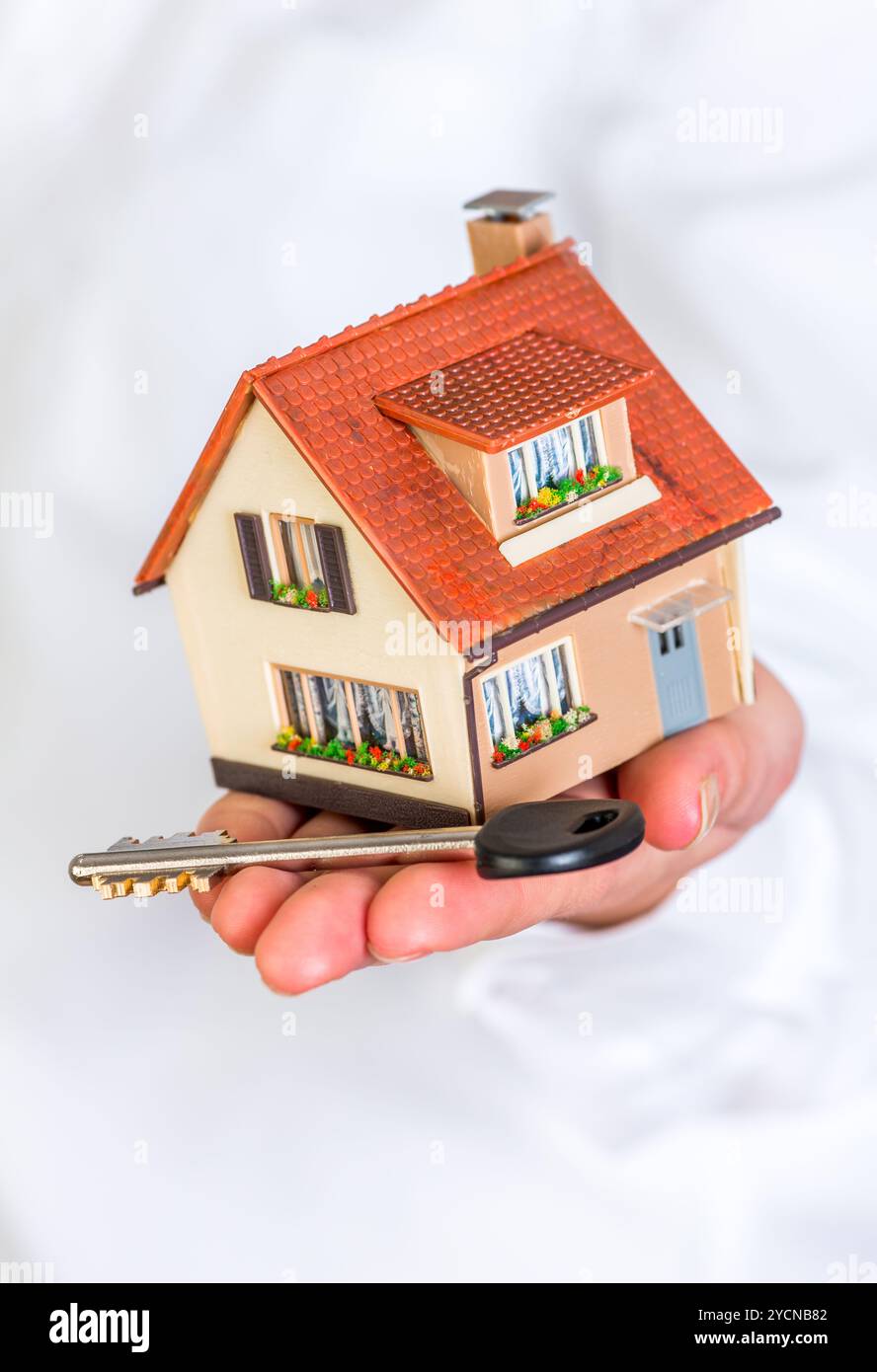 House in human hands Stock Photo - Alamy