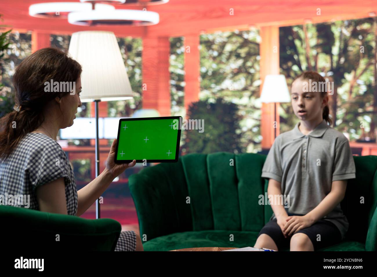 Teen girl in behavioral therapy next to copy space mockup discussing ...