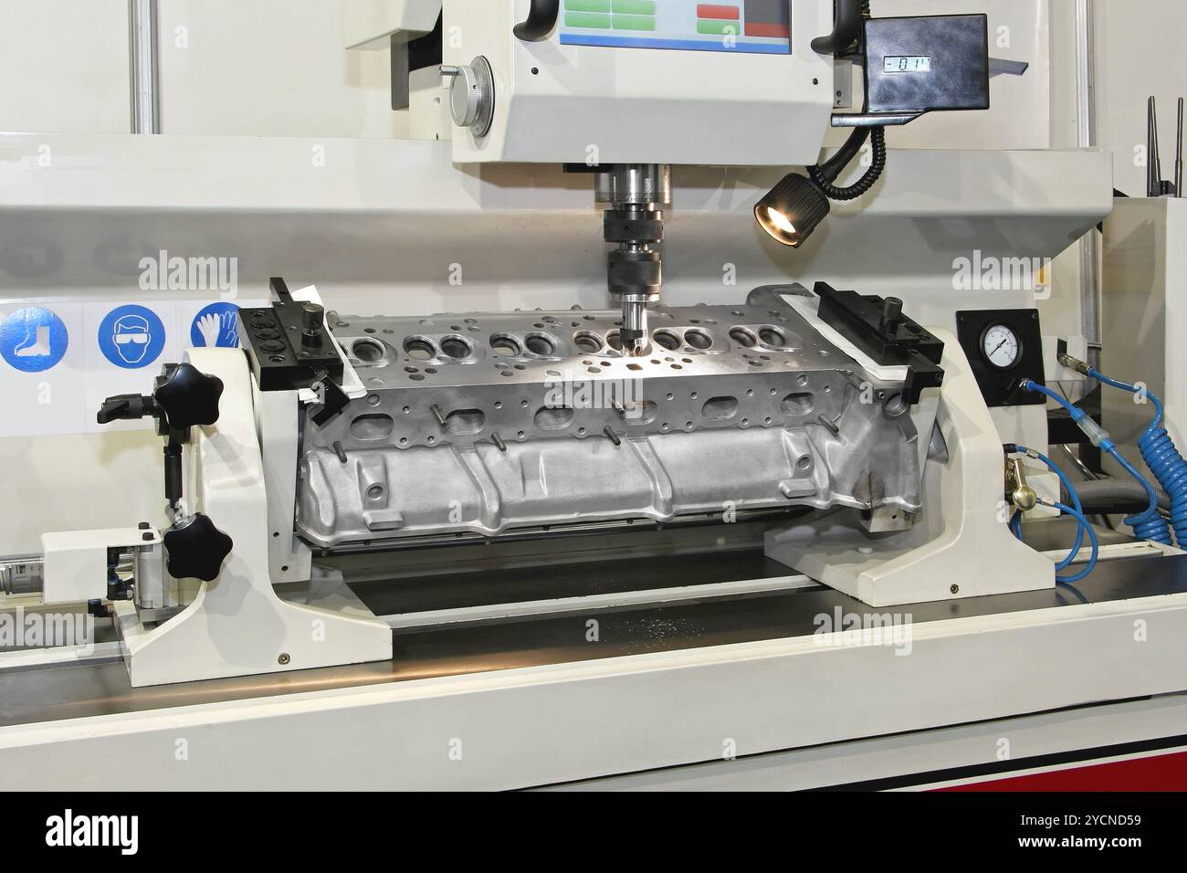 Machining engine head block at automated lathe Stock Photo - Alamy