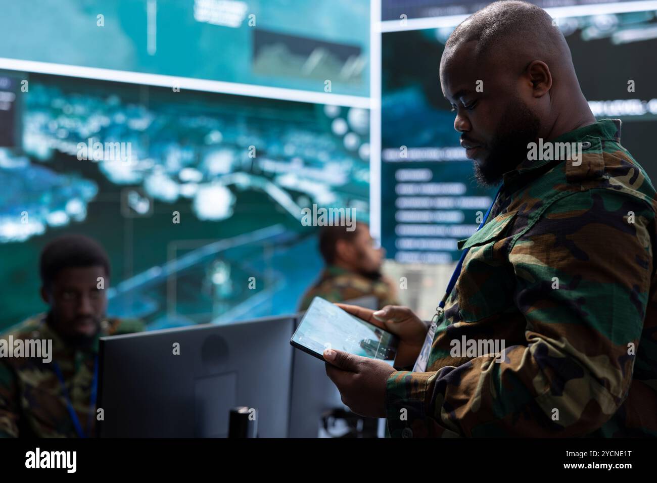 Government intelligence officers in a control center managing ...