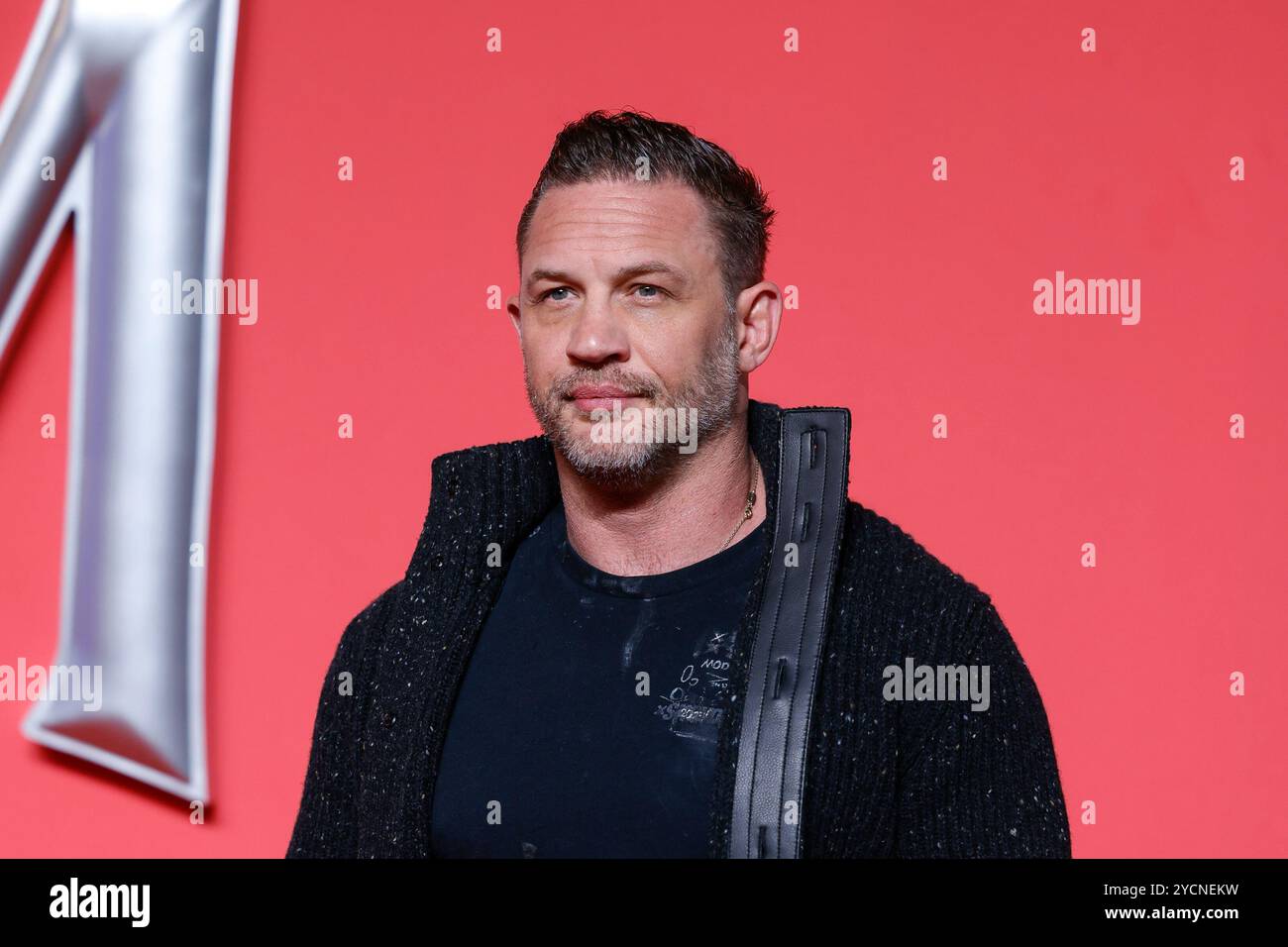 Tom Hardy poses for photographers upon arrival at the premiere of the ...