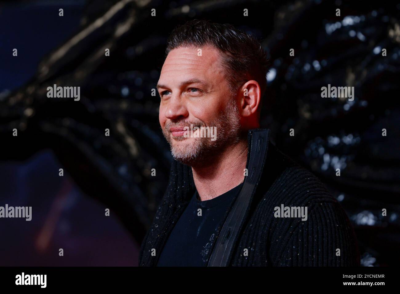 Tom Hardy poses for photographers upon arrival at the premiere of the ...