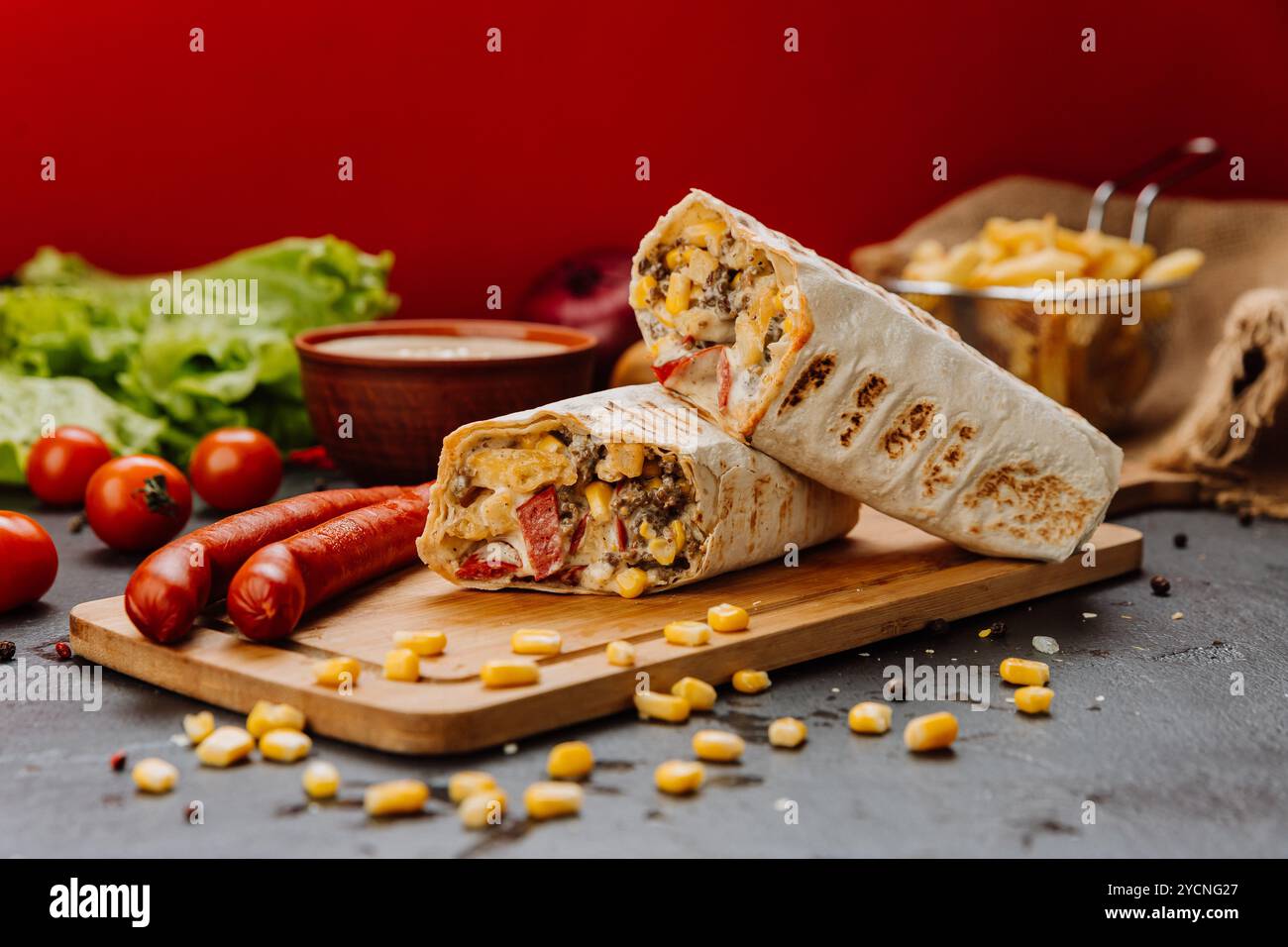 Grilled wrap filled with sausage, corn, and melted cheese. Hearty meal ...