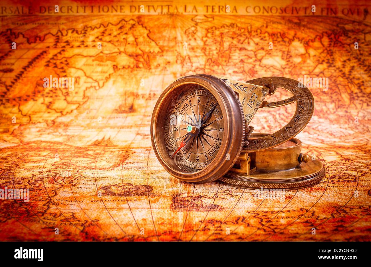 Vintage compass lies on an ancient world map Stock Photo - Alamy