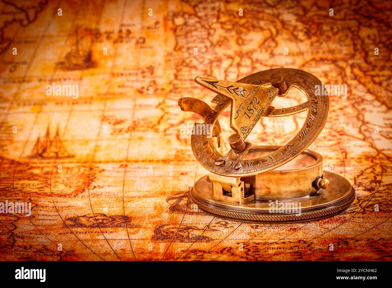 Vintage compass lies on an ancient world map Stock Photo - Alamy