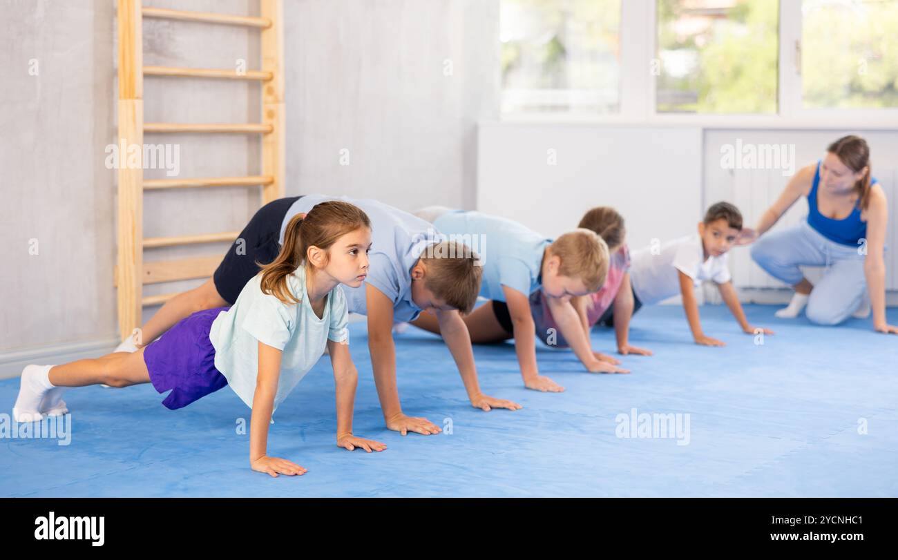 Children are performing push-ups Stock Photo - Alamy