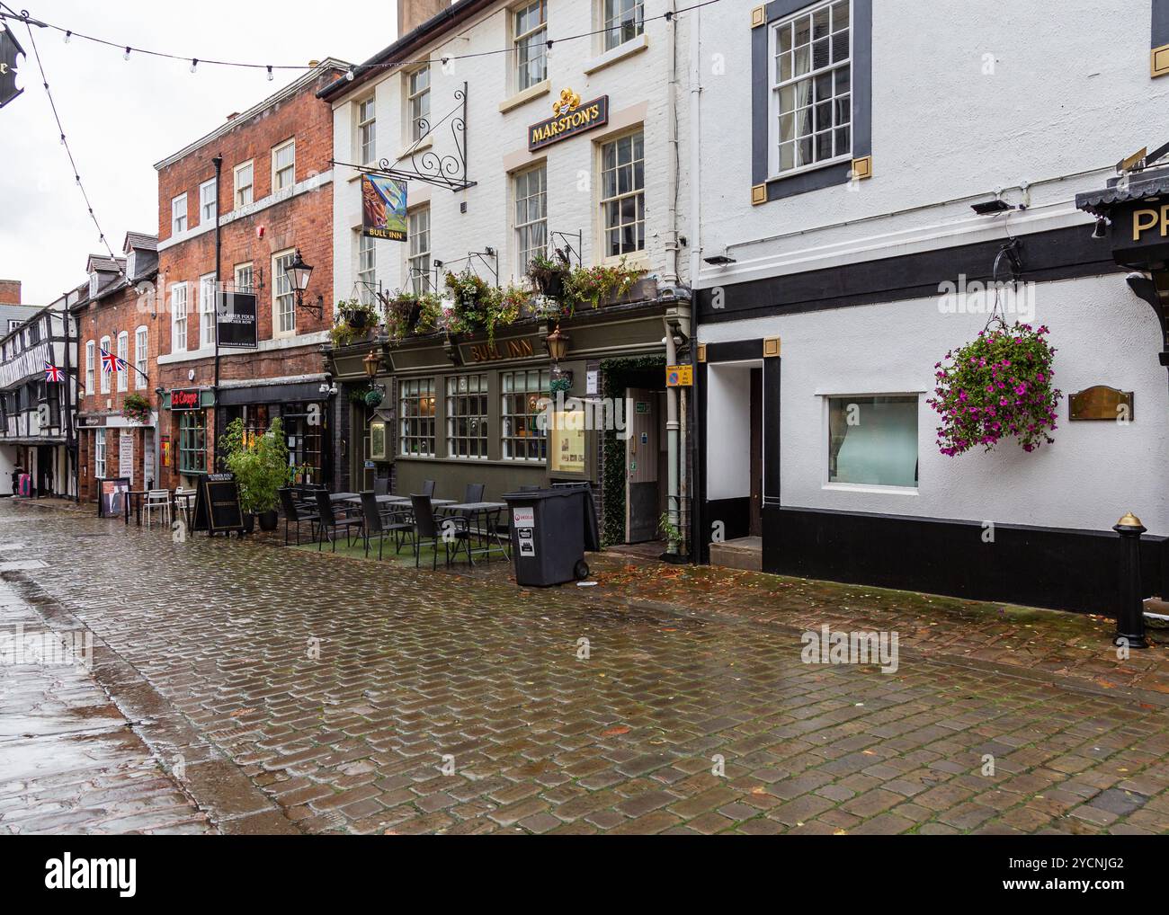 Rainy street view of Butcher Row in Shrewsbury, UK Stock Photo - Alamy