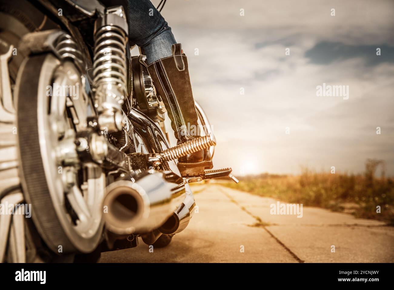 Biker girl riding on a motorcycle Stock Photo - Alamy