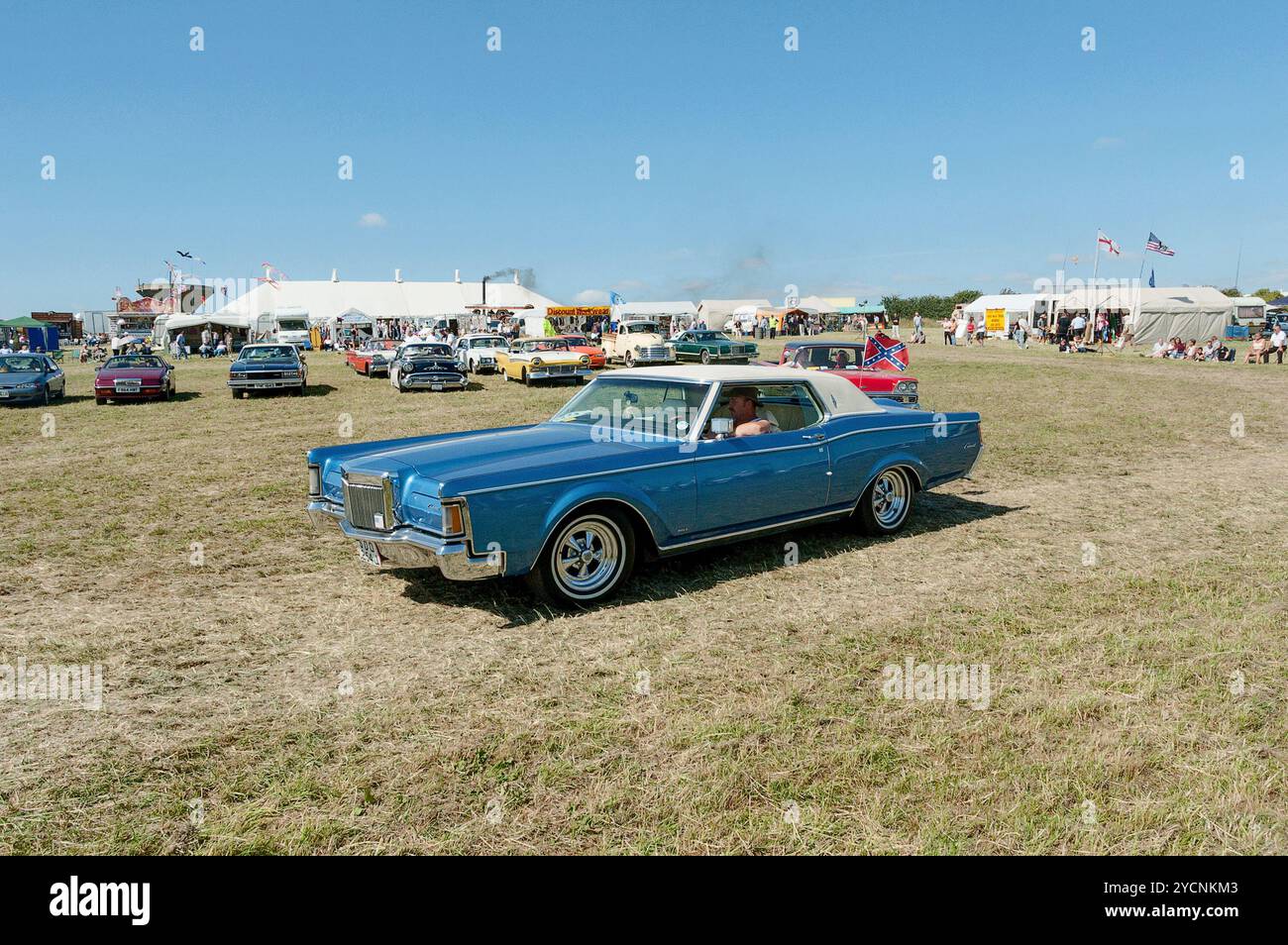 A blue Lincoln car drives around the ring at the Ackworth Classic ...