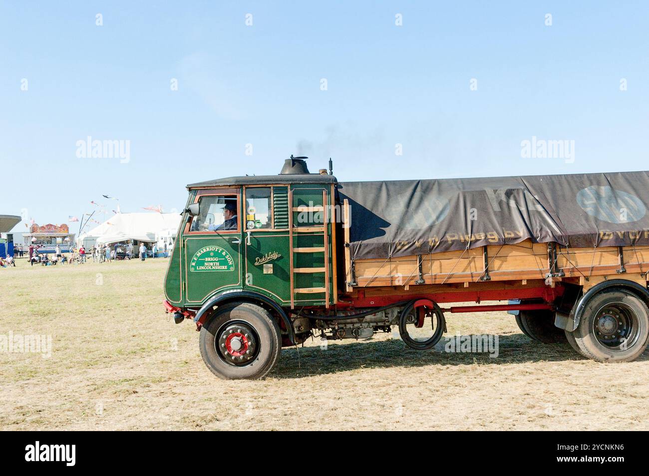 A 1933 green Sentinel steam powered truck, UJ 2225, drives around the ...