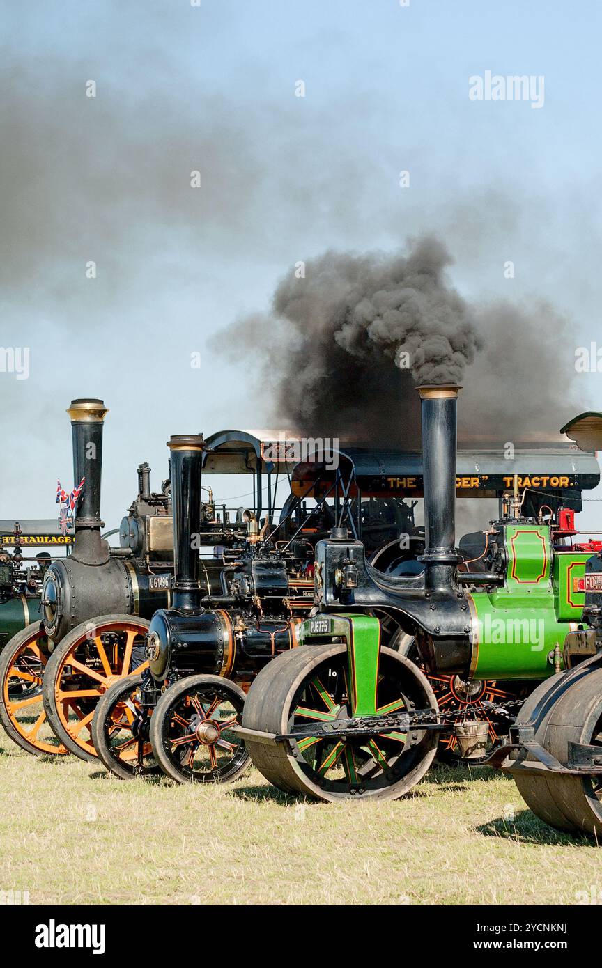 Smoke pouring from the funnels of steam engines on display at the ...
