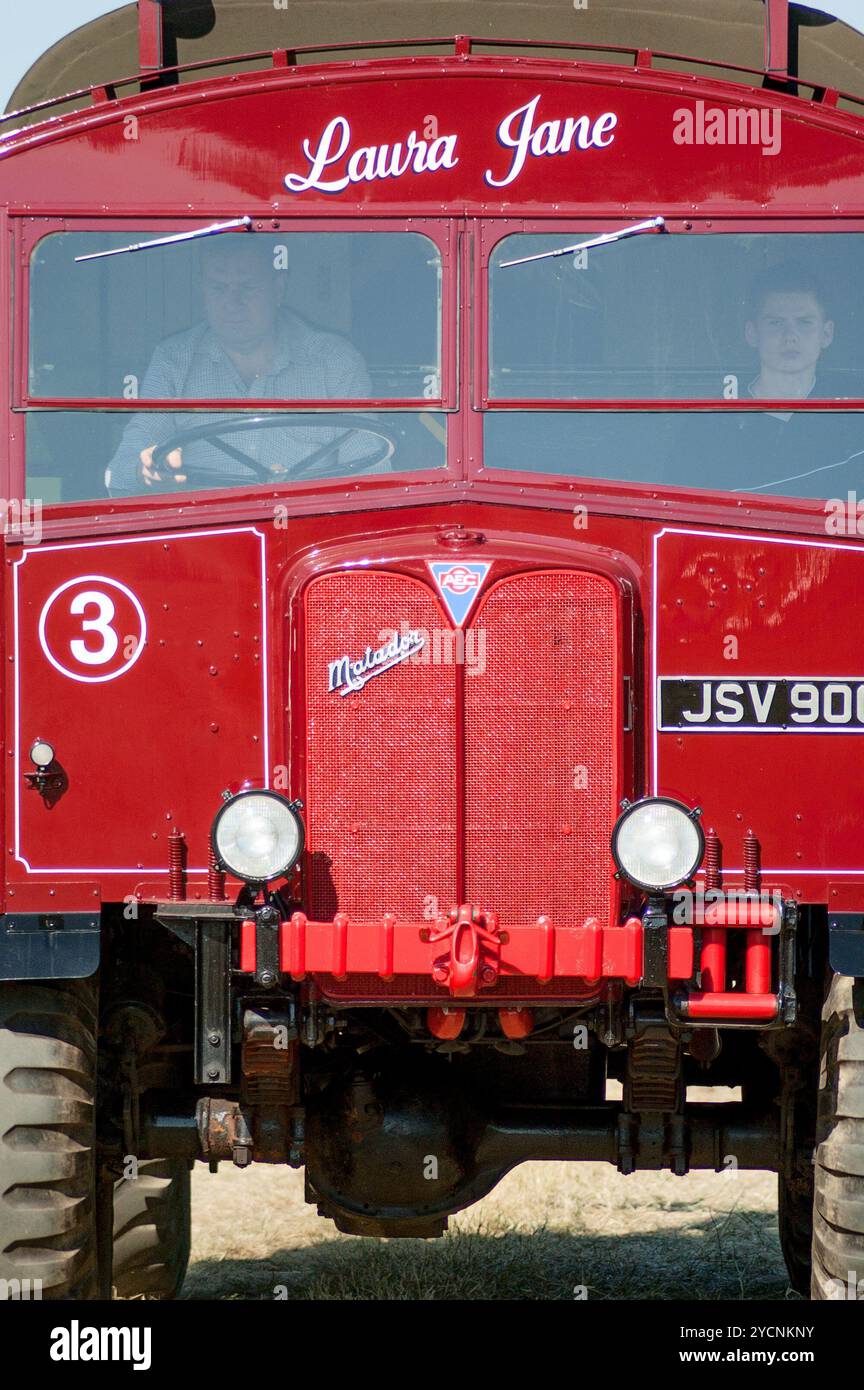 A red 1943 AEC Matador truck drives around the ring at the Ackworth ...