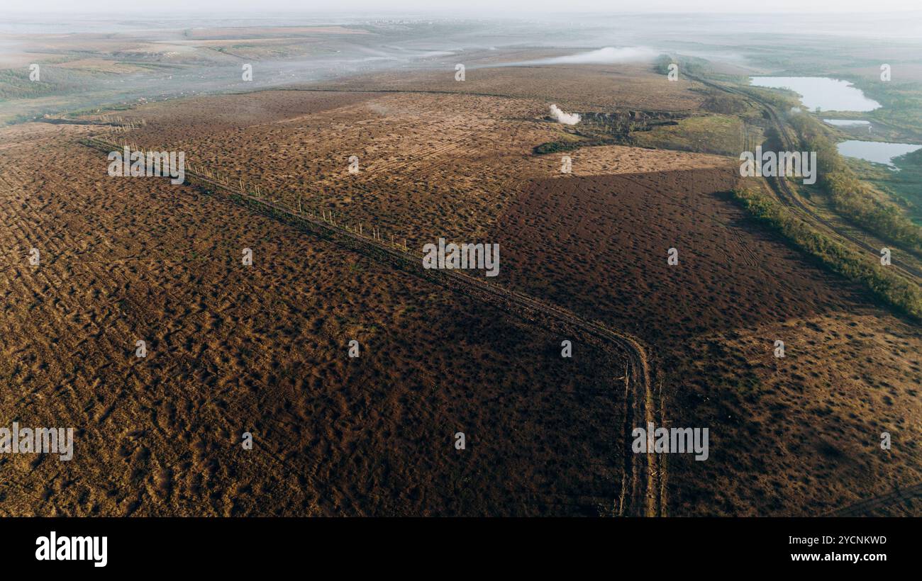 Earth after the war. Ukraine. Explosion craters and a destroyed village ...