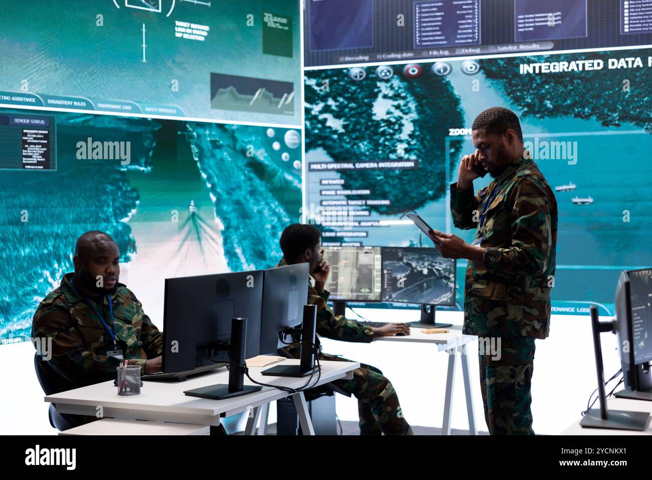 Military team in a command center uses advanced technology on big ...