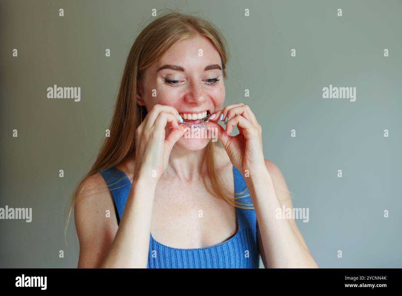Woman wearing orthodontic silicone trainer. Invisible braces aligner ...