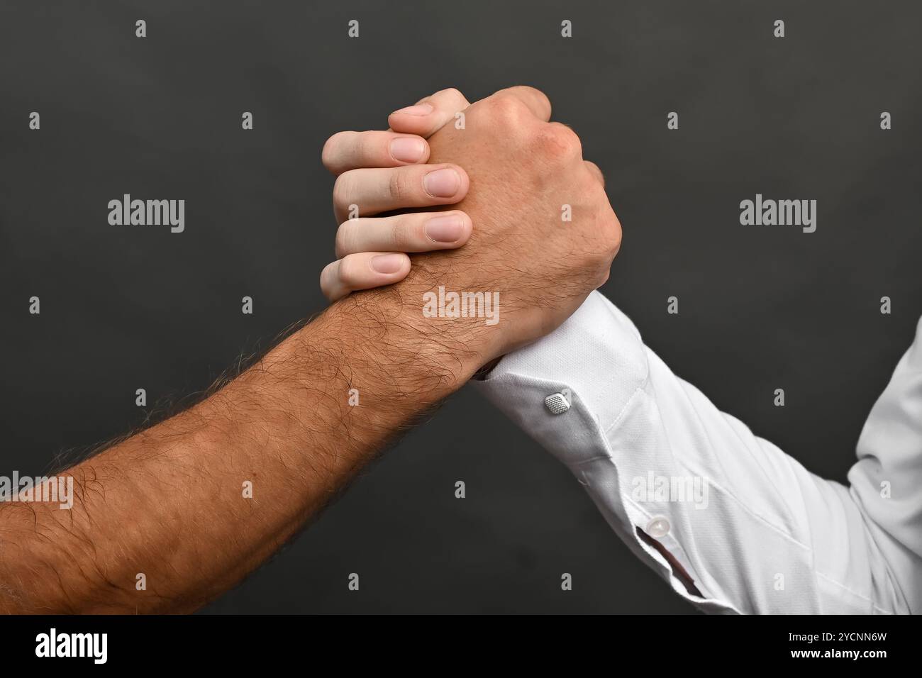 the hands of friends greeting each other. the concept of male power ...