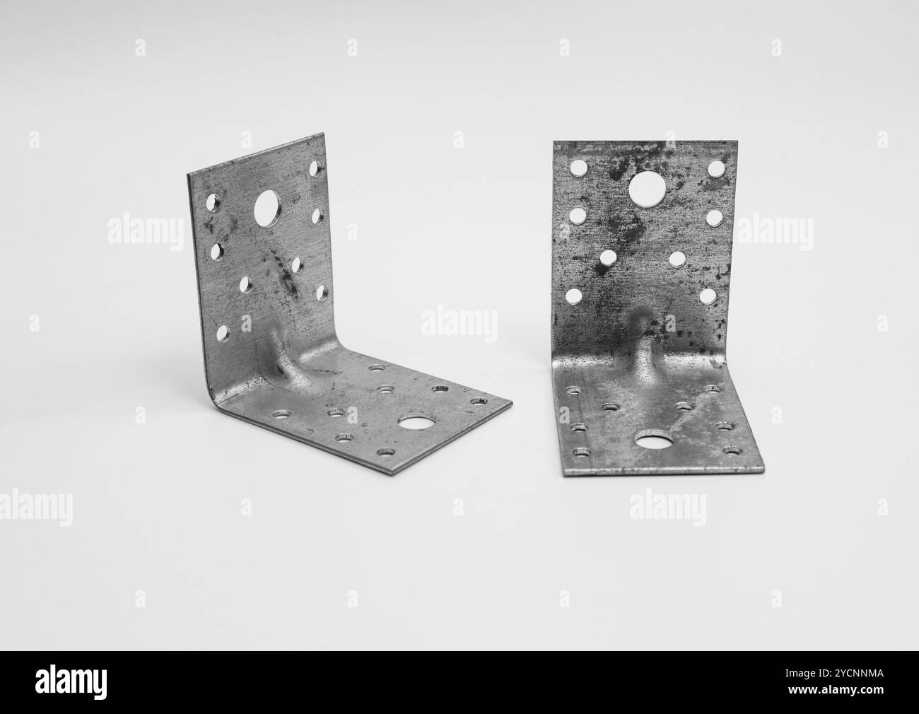 metal corners for fasteners on a white background Stock Photo - Alamy