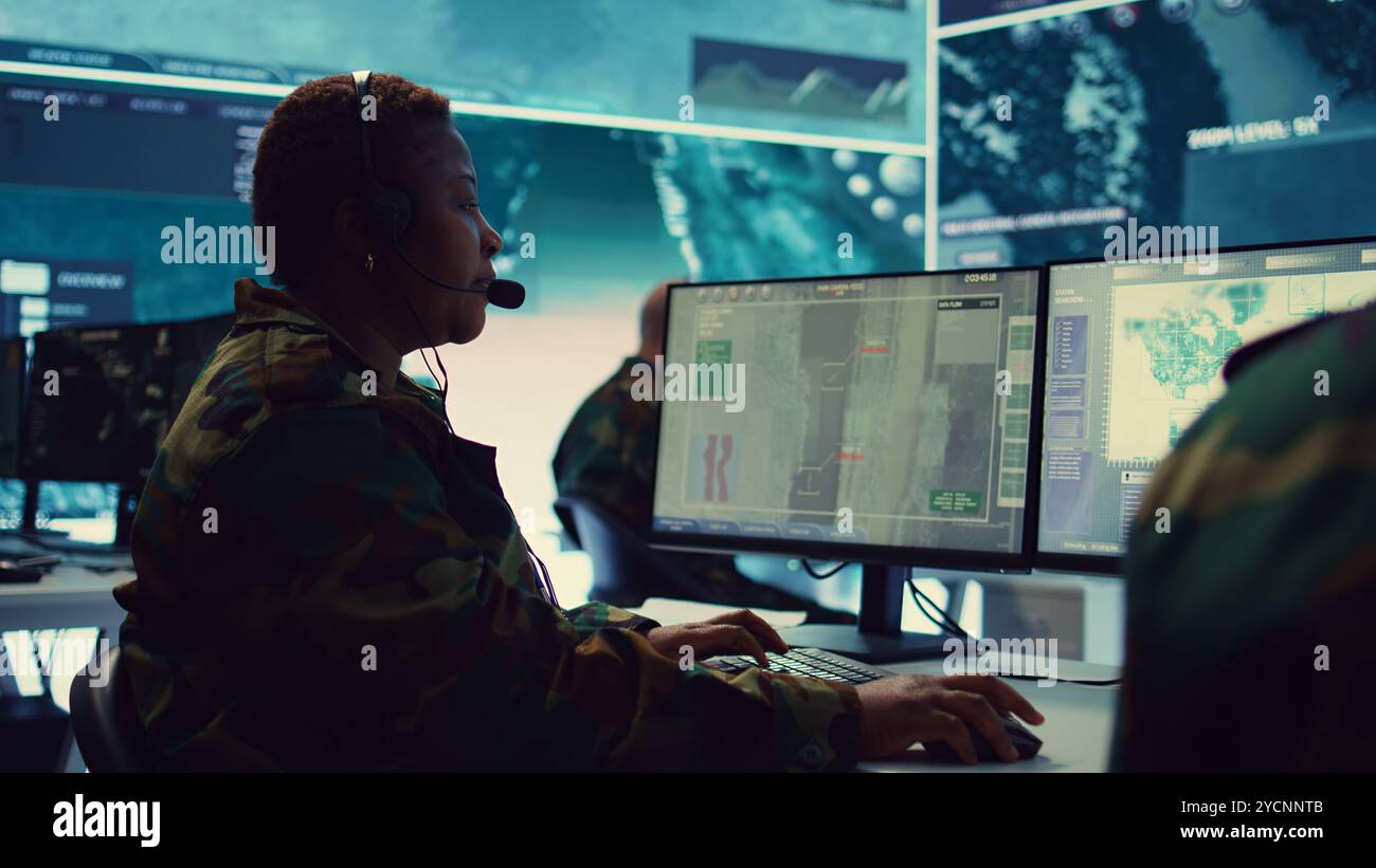 Female army operator registers important information from military ...