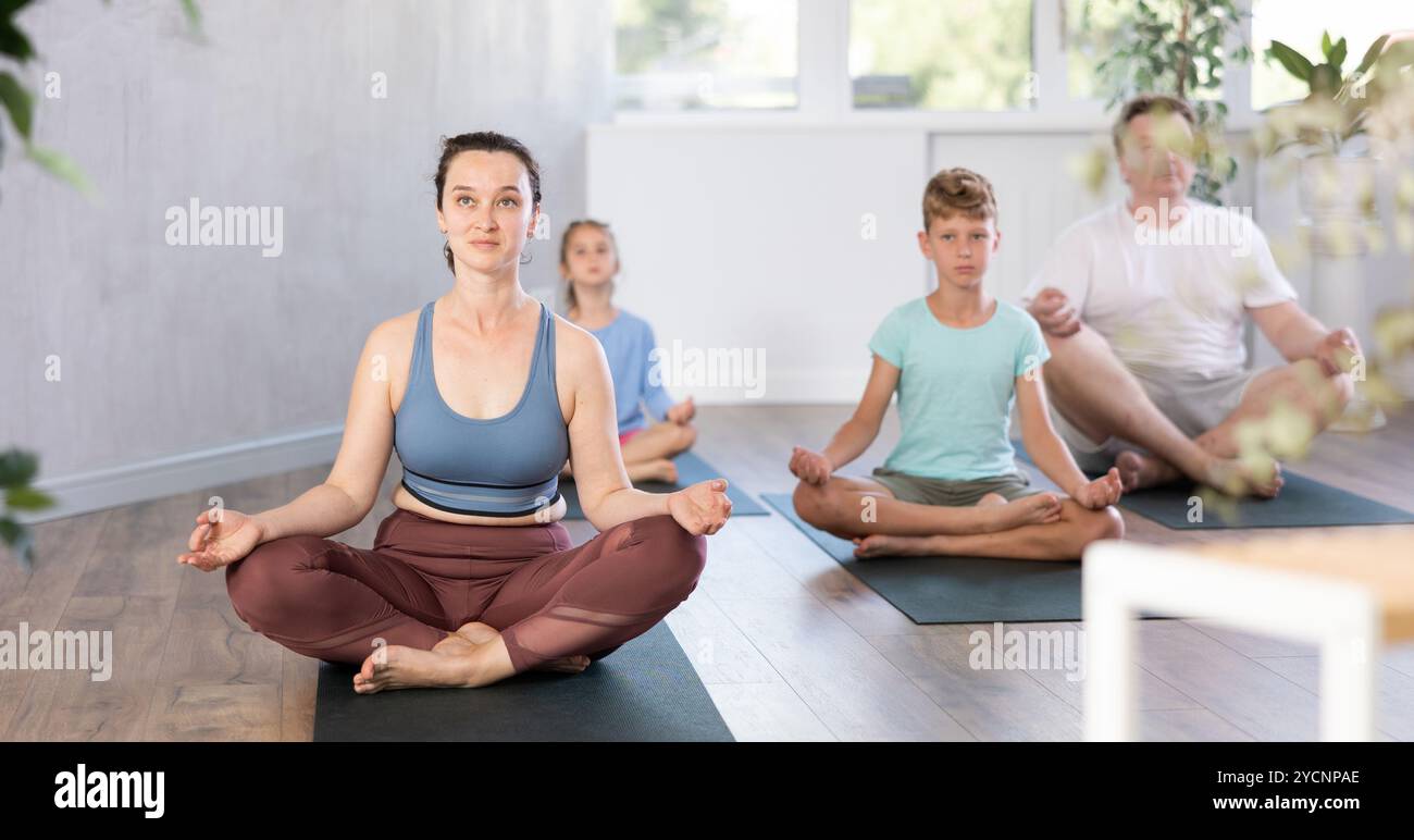 Woman performs lotus pose, folding fingers in mudra of knowledge Stock ...