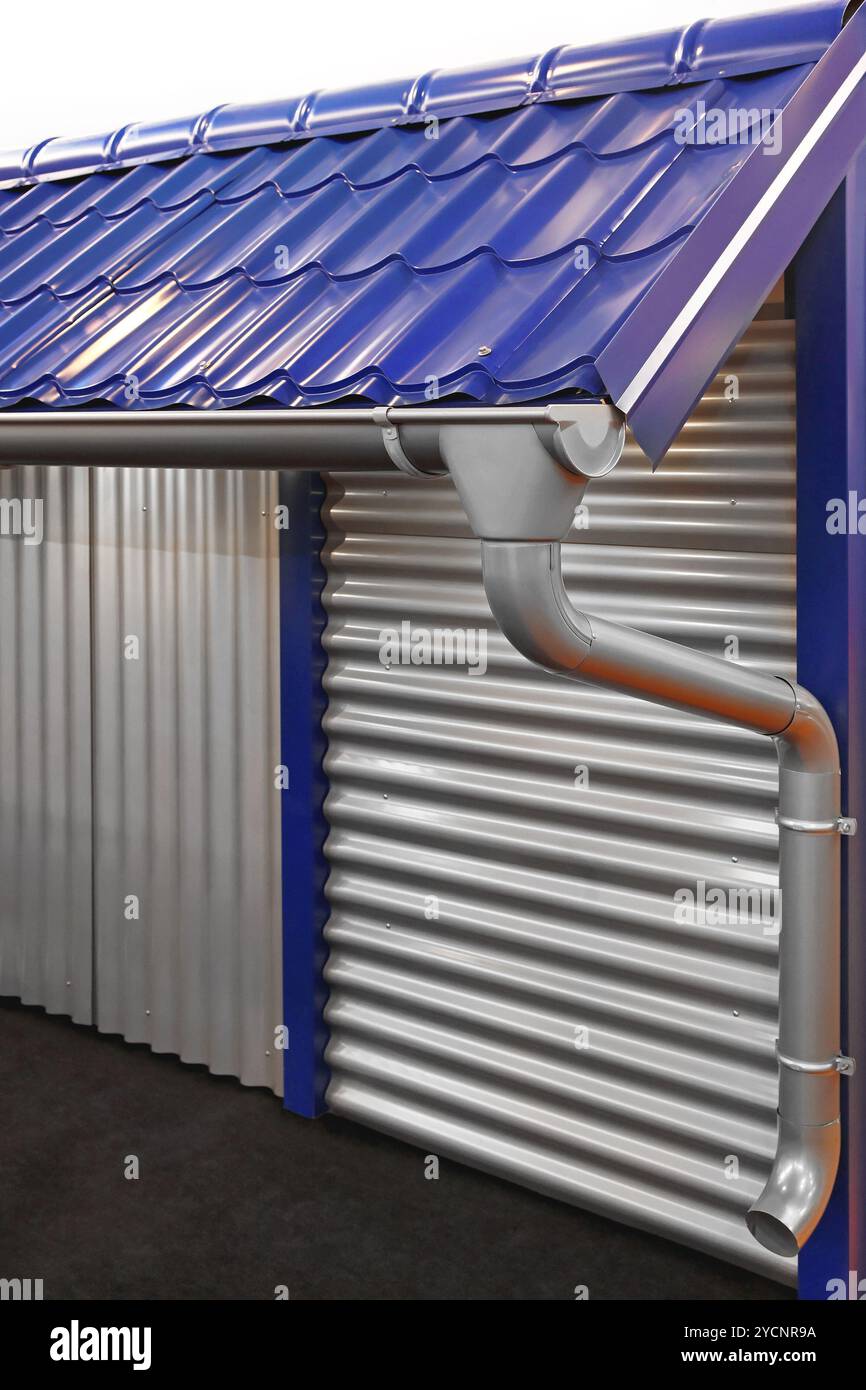 Complete system of rain gutter for collects rainwater Stock Photo - Alamy