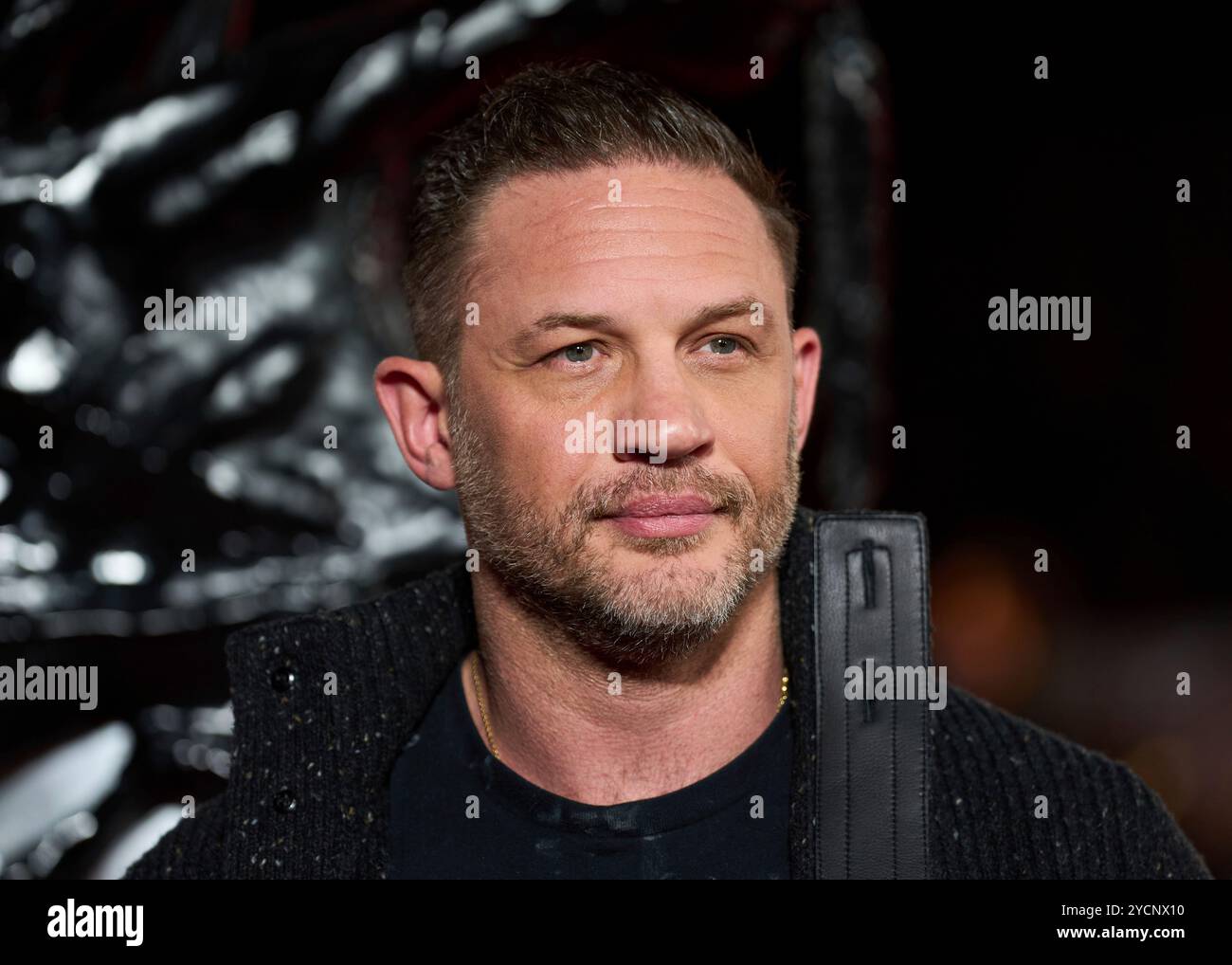 Tom Hardy poses for photographers upon arrival at the premiere of the ...