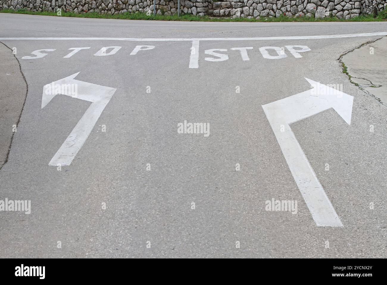 Two ways choice with arrows at intersection Stock Photo - Alamy