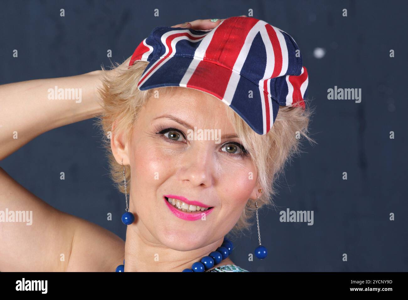 Adult woman in union jack cap Stock Photo - Alamy