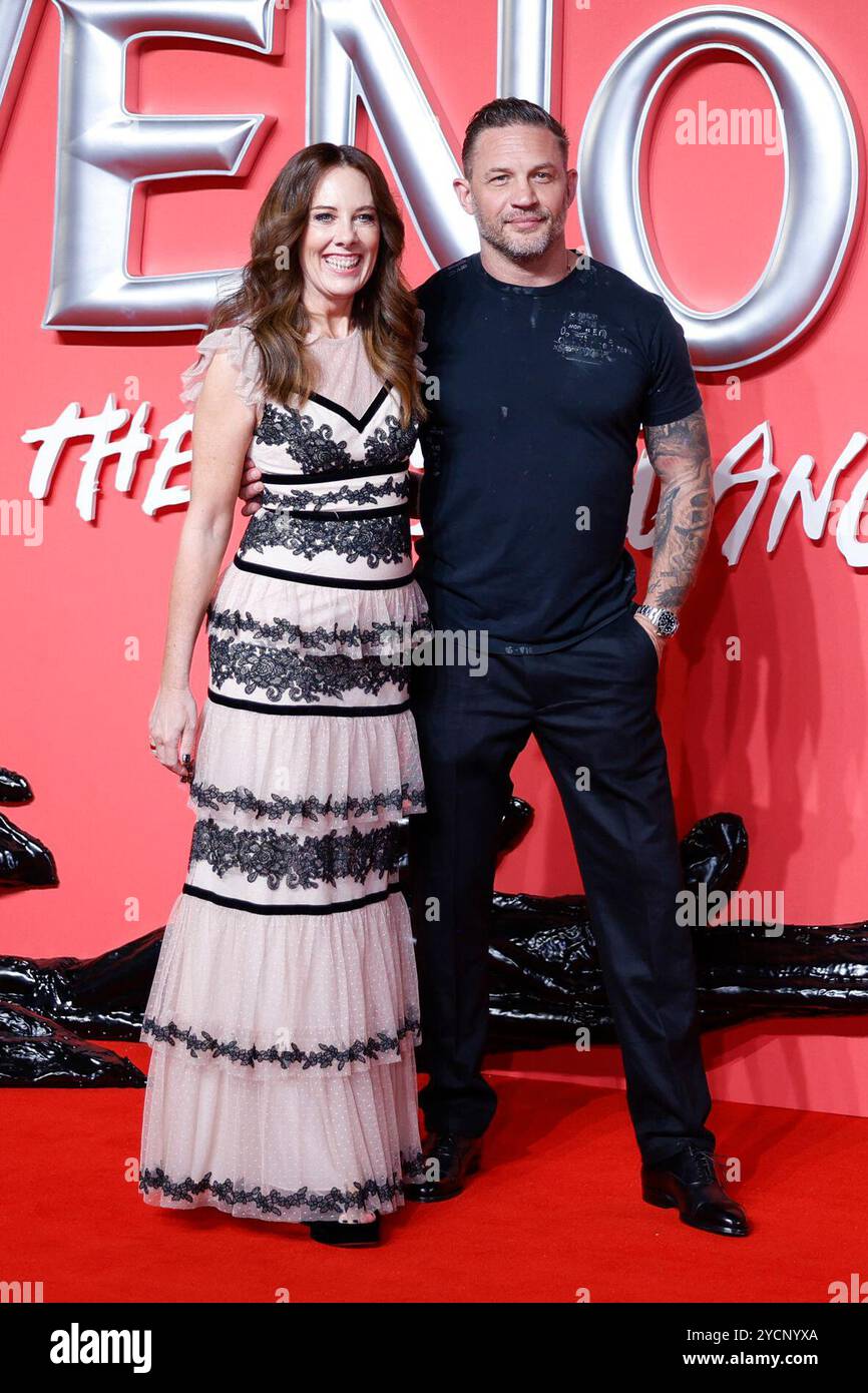 Director Kelly Marcel, from left, and Tom Hardy pose for photographers ...